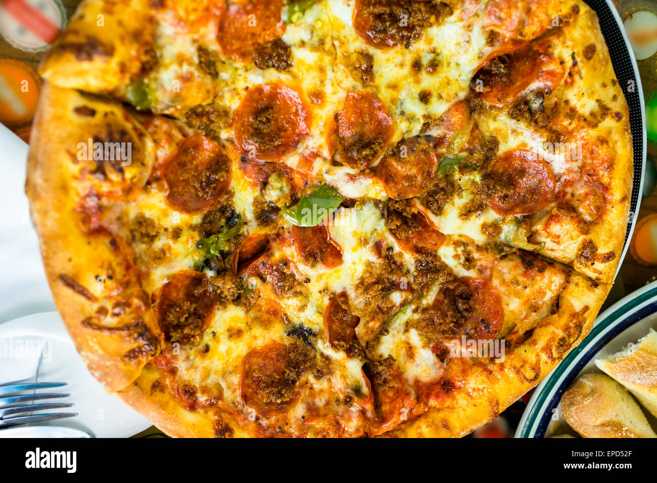 Fresh combo pizza in Italian restaurant Stock Photo - Alamy