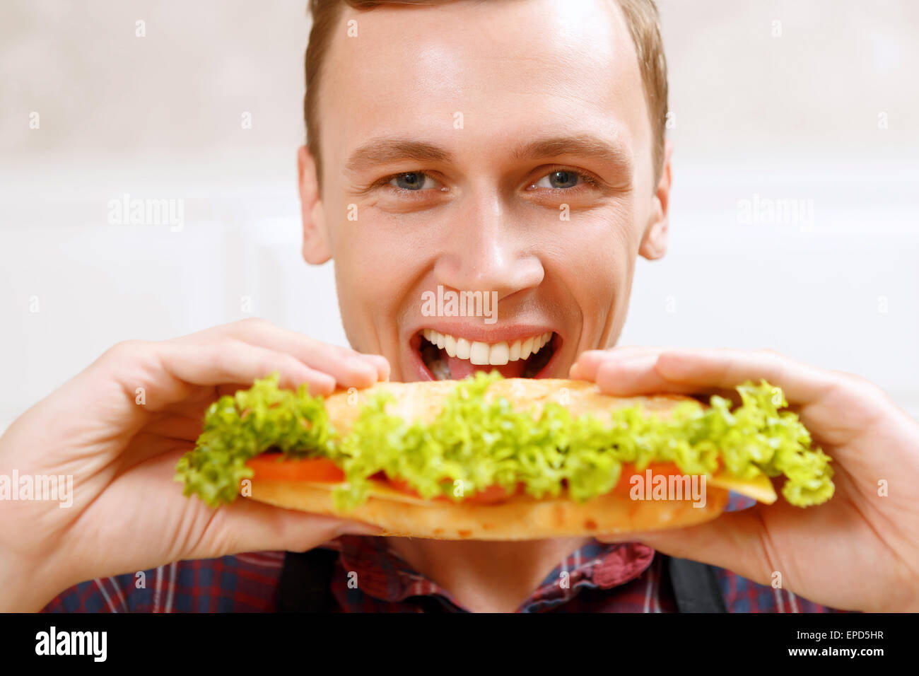 Man taking bite delicious hi-res stock photography and images - Alamy
