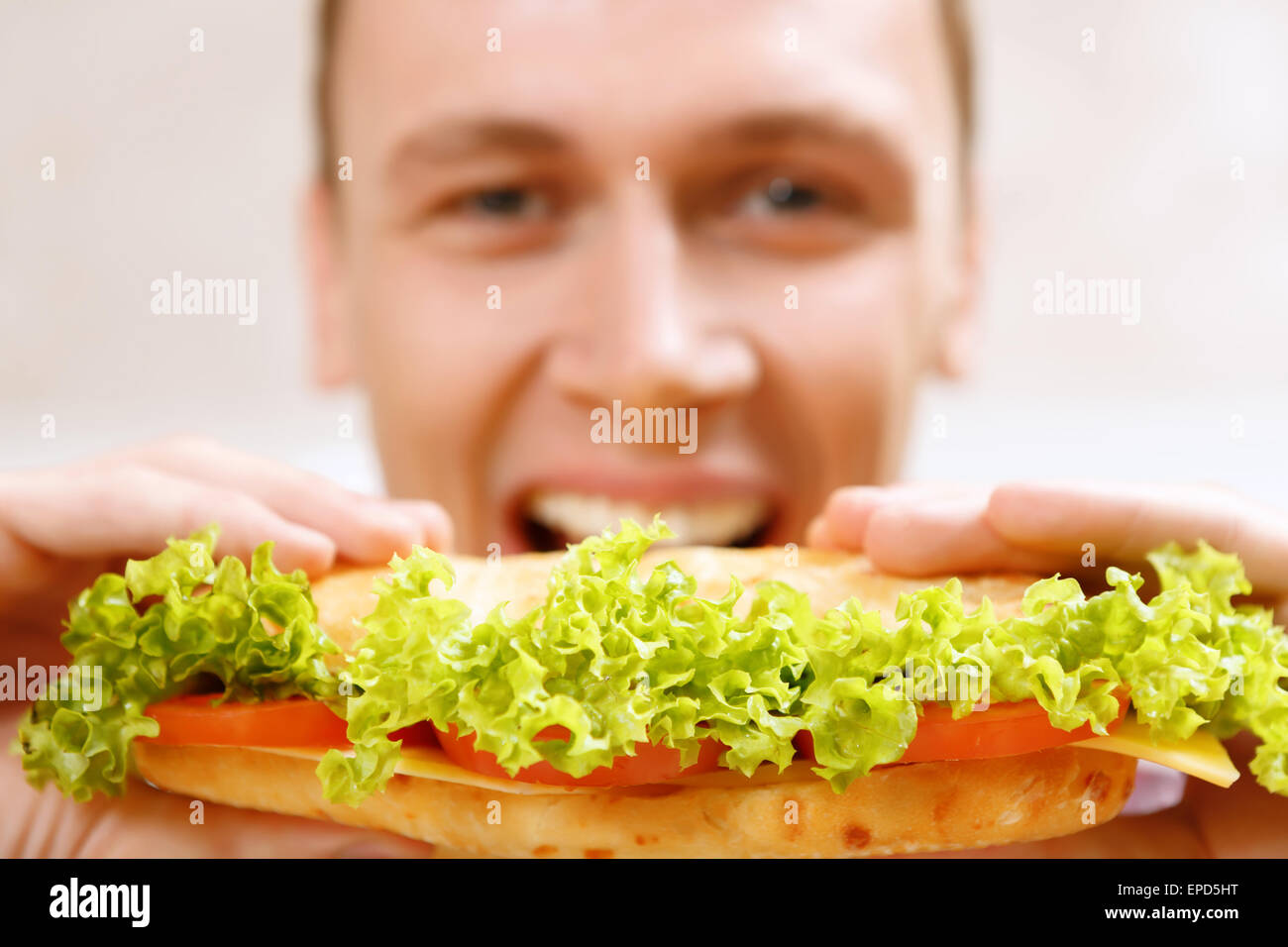 Man taking bite delicious hi-res stock photography and images - Alamy