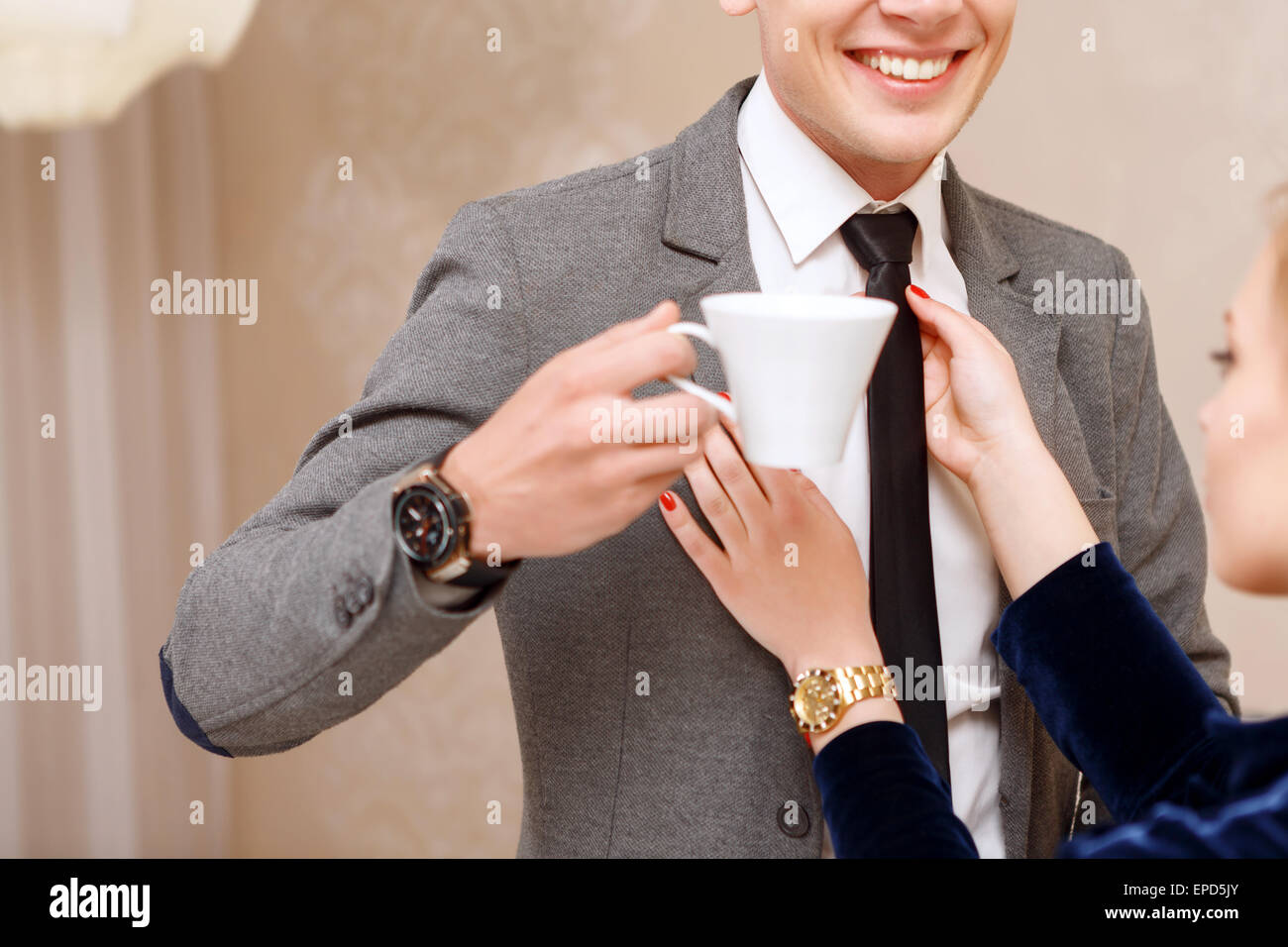 Fixing tie hi-res stock photography and images - Alamy