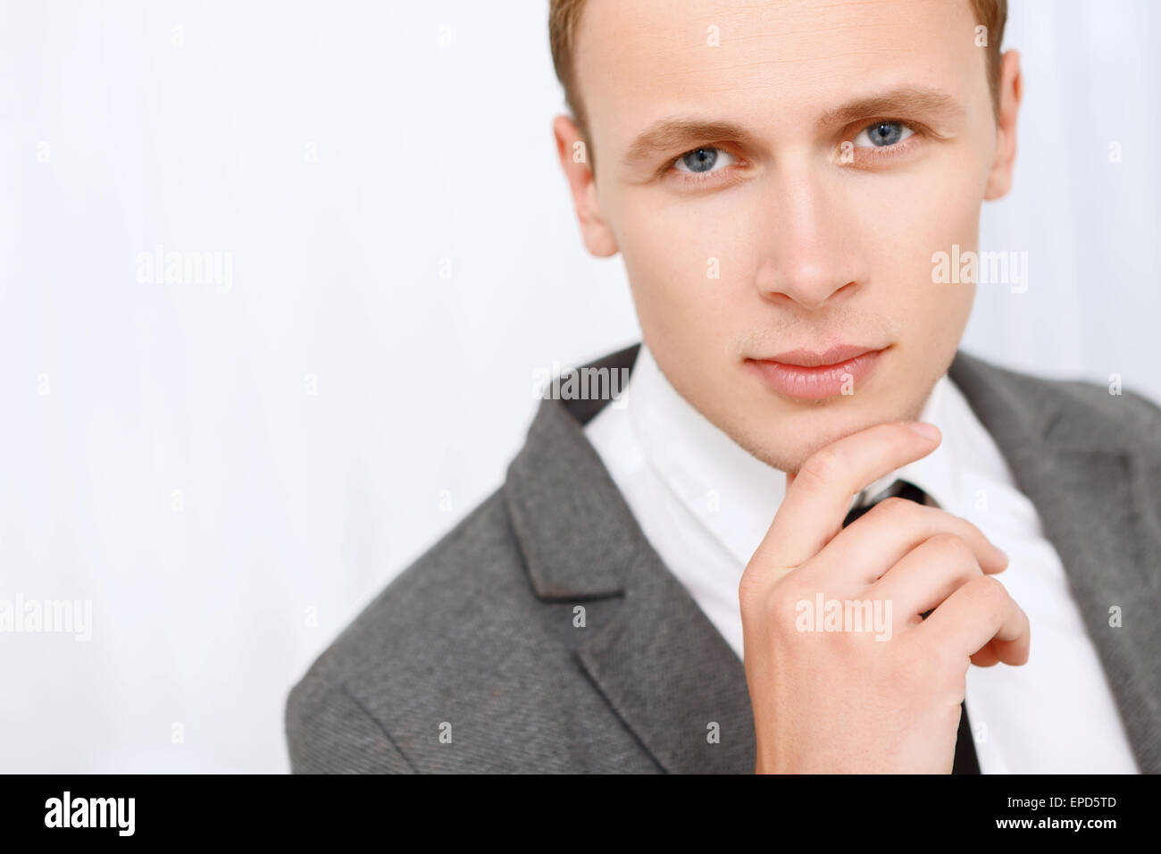 Close up of man touching his chin Stock Photo - Alamy