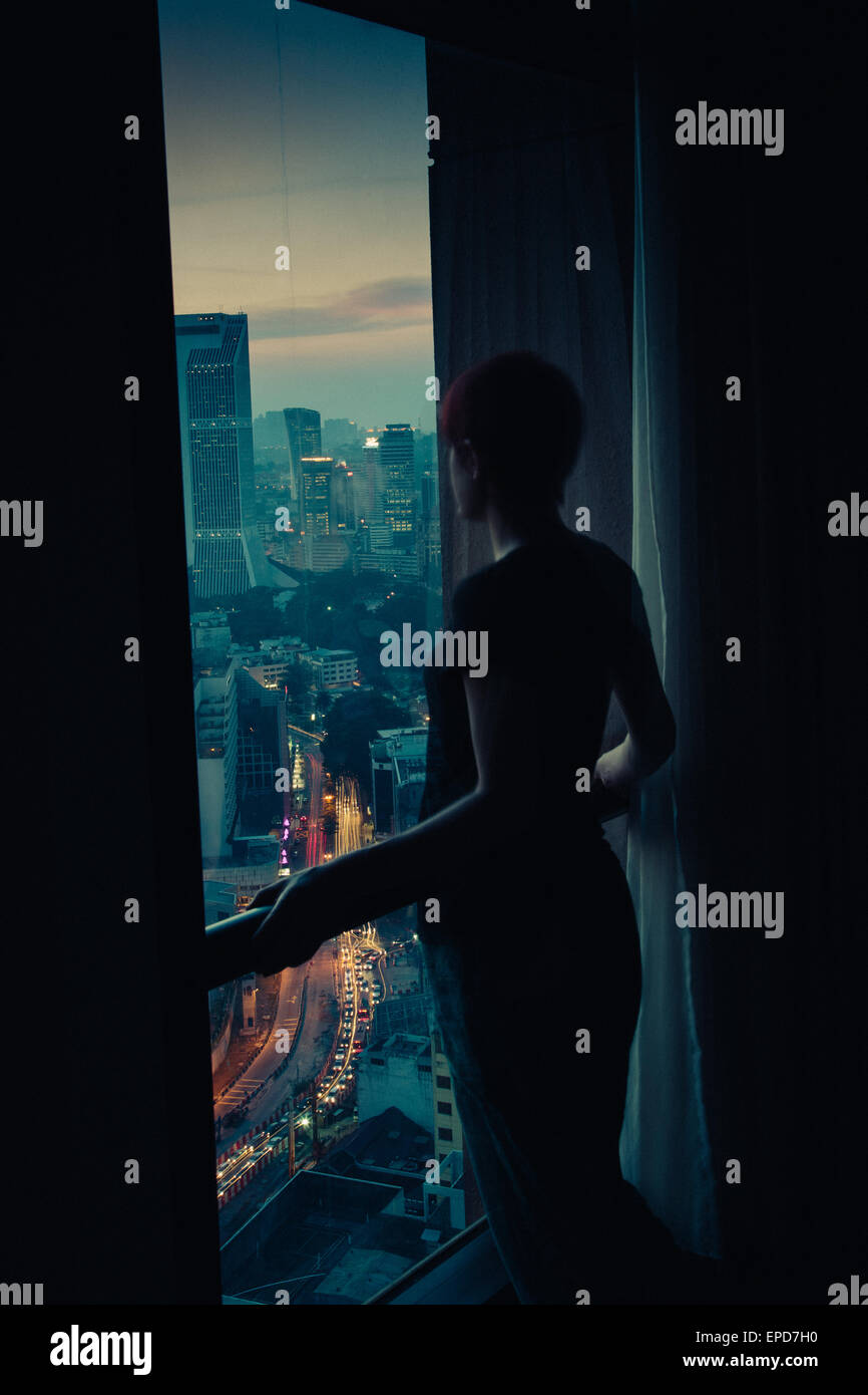 Staring at window silhouette hi-res stock photography and images - Alamy