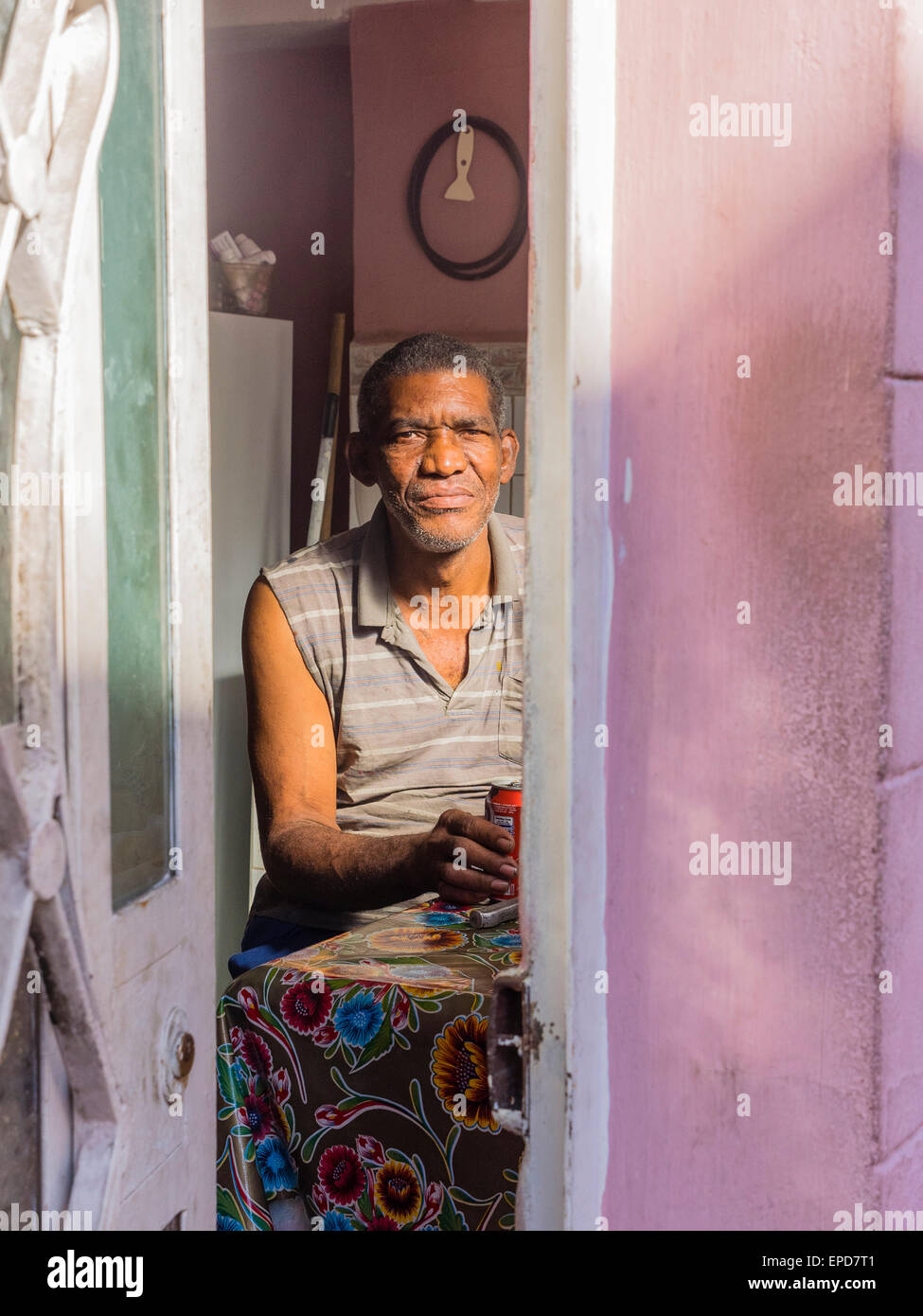 A view from outside to the inside of the home of an Afro-Cuban man ...