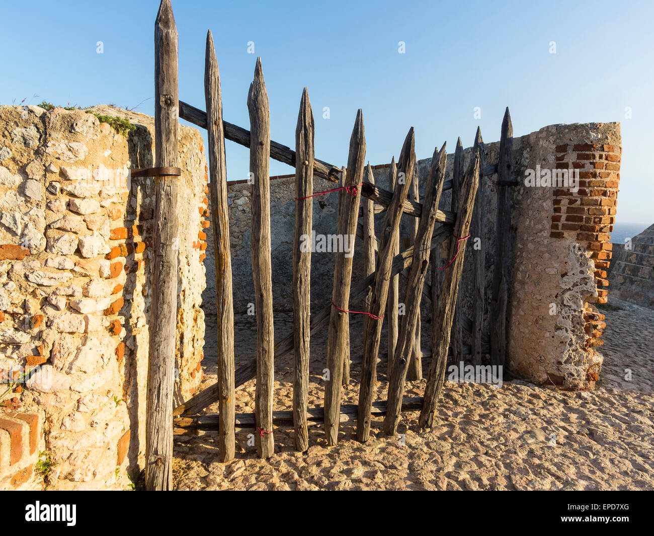 Old wooden gate made of pointed columns of wood at San Pedro de la Roca ...