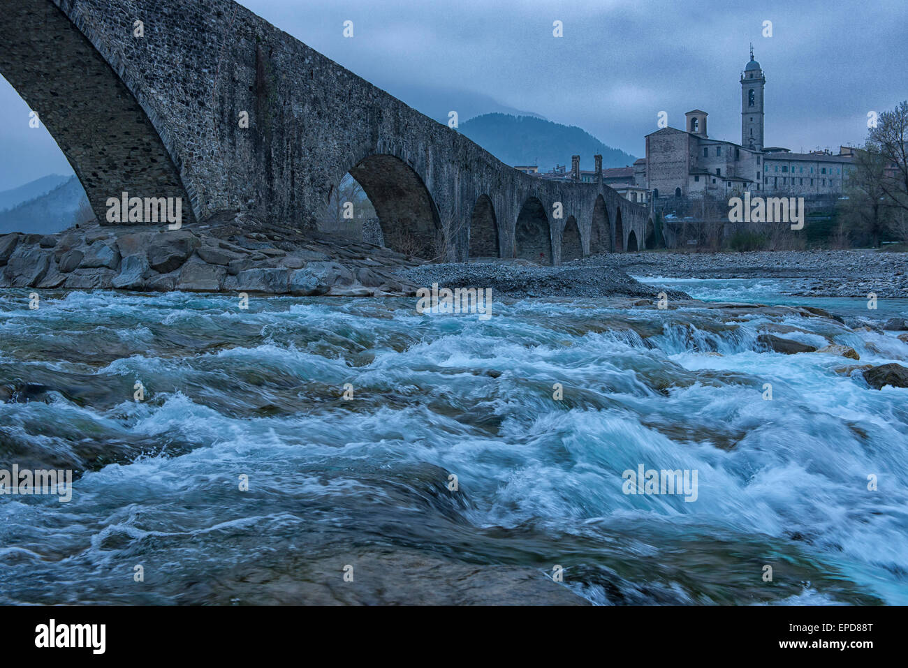 The old town of Bobbio and the bridge Gobbo by night, Piacenza Area ...