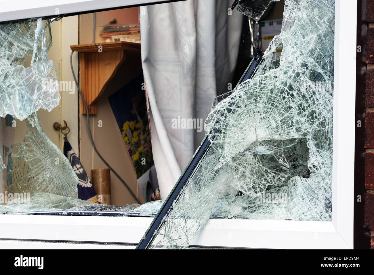 Broken toughened glass window after burglary Stock Photo - Alamy