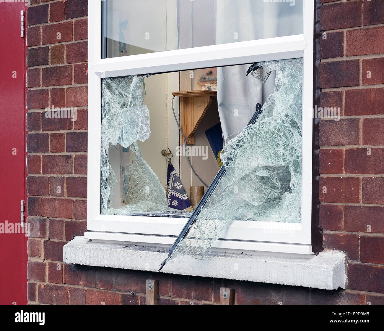 Broken toughened glass window after burglary Stock Photo - Alamy