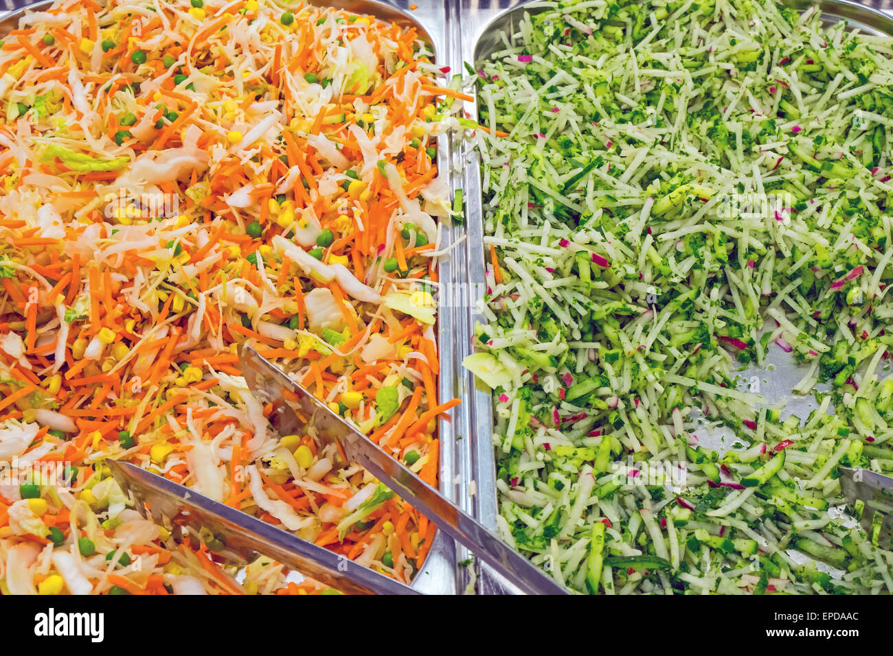 Coleslaw and cucumber salad seen at buffet in a restaurant Stock Photo ...