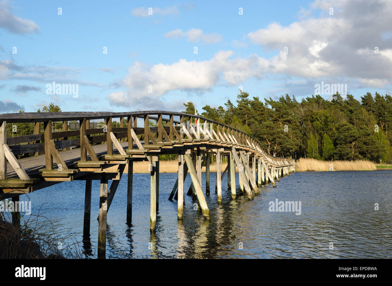 Old wooden footbridge constructed with tall poles Stock Photo - Alamy