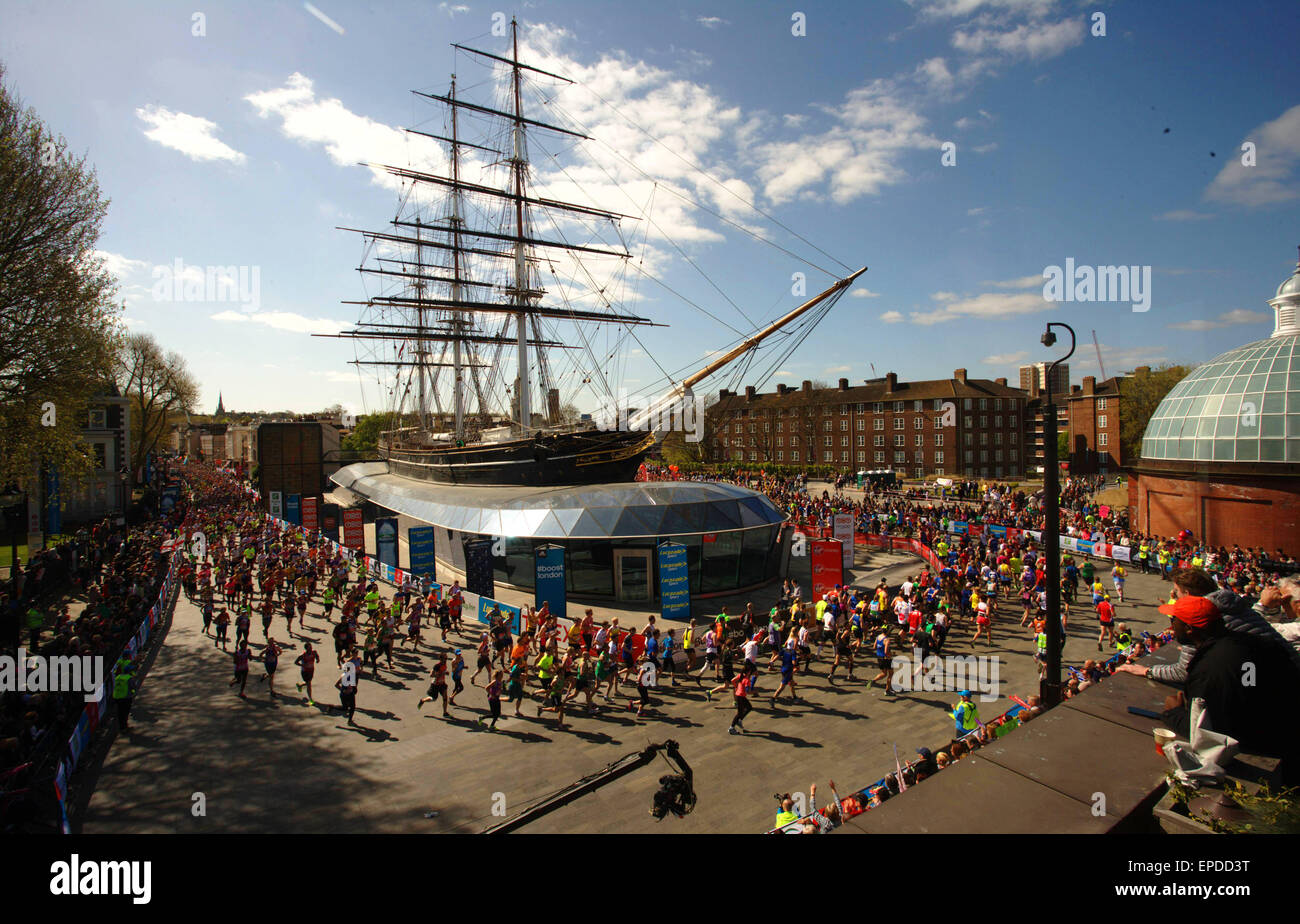 London Marathon runners pass the Cutty Sark in Greenwich, London ...
