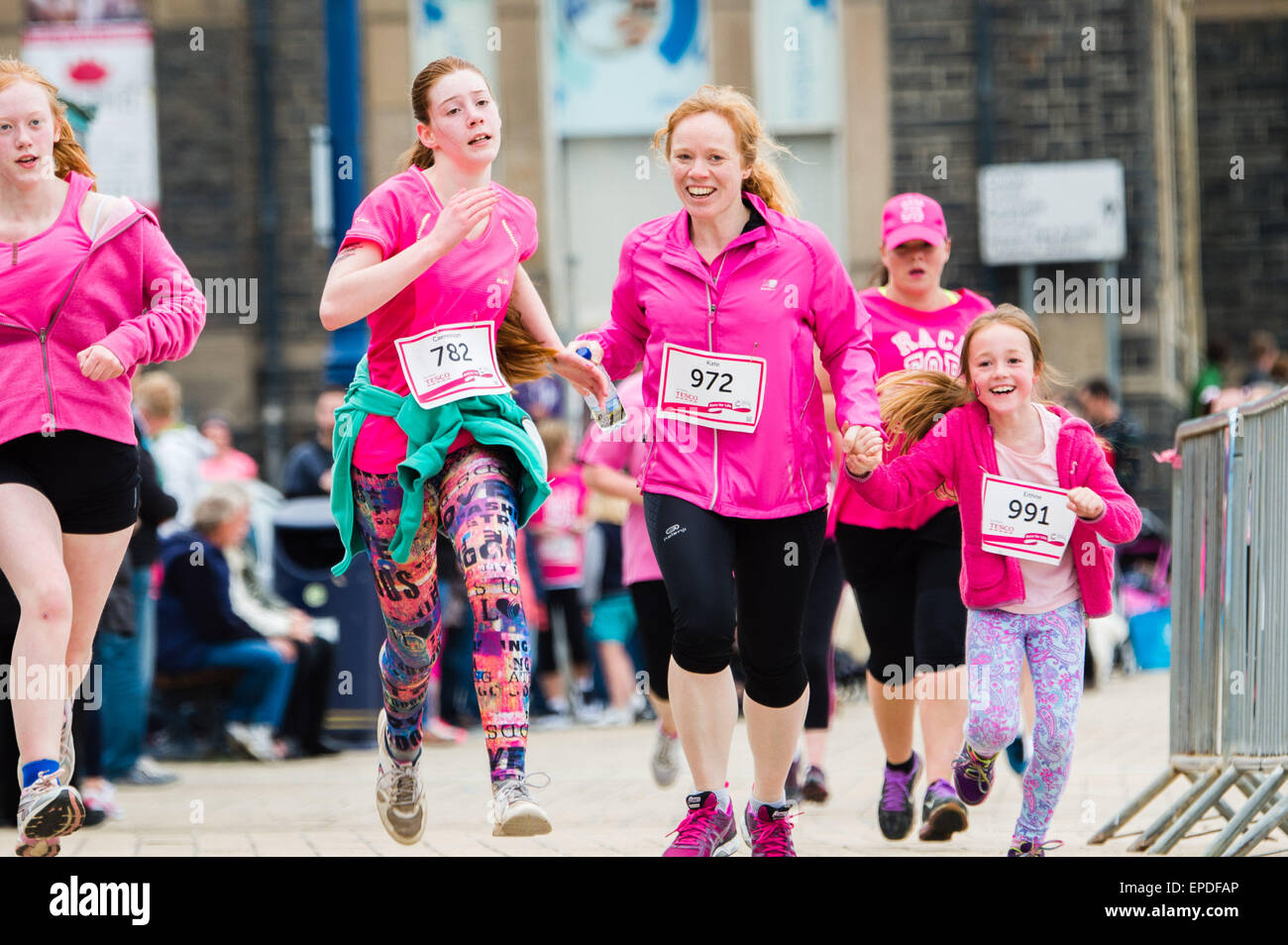 Girl crossing finishing line hi-res stock photography and images - Alamy