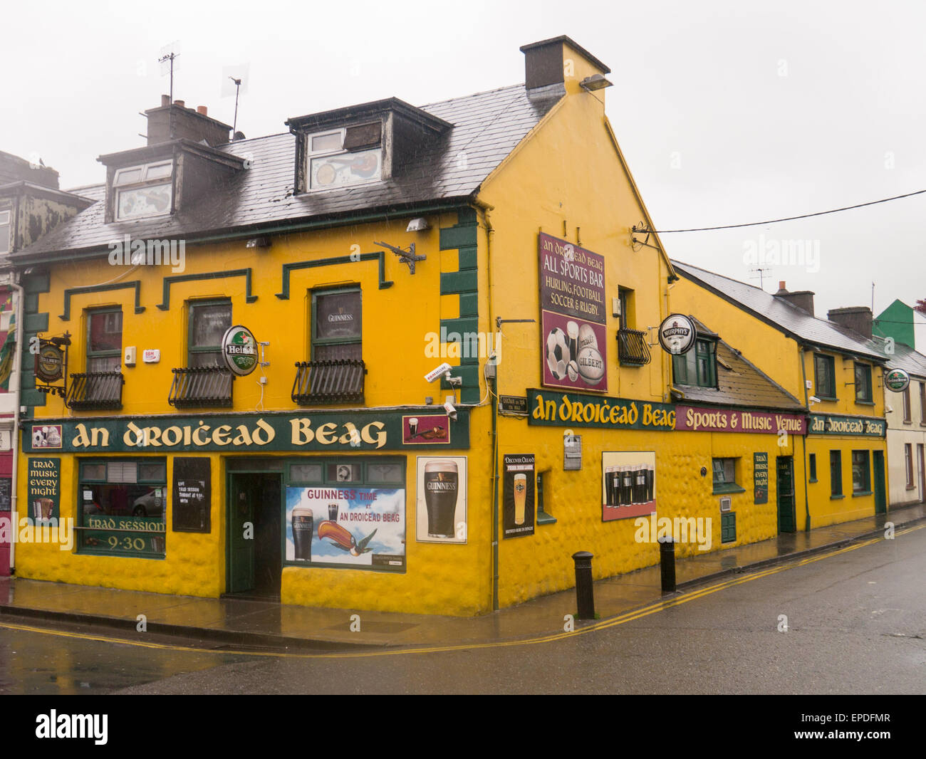 Pubs and other brightly coloured buildings in Dingle, a small town on ...