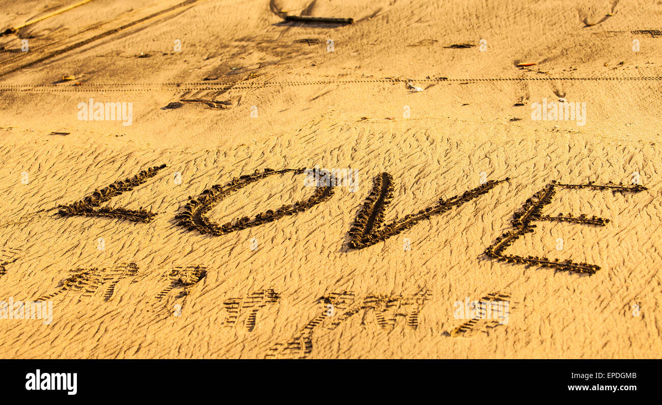 Love message on sand Stock Photo - Alamy