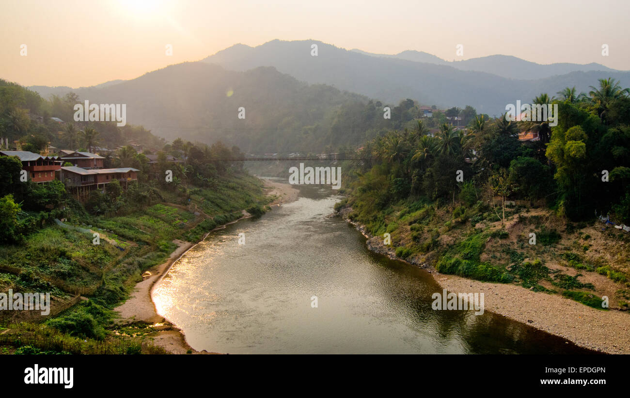 A view to a beautiful river in Laos during sunset Stock Photo - Alamy