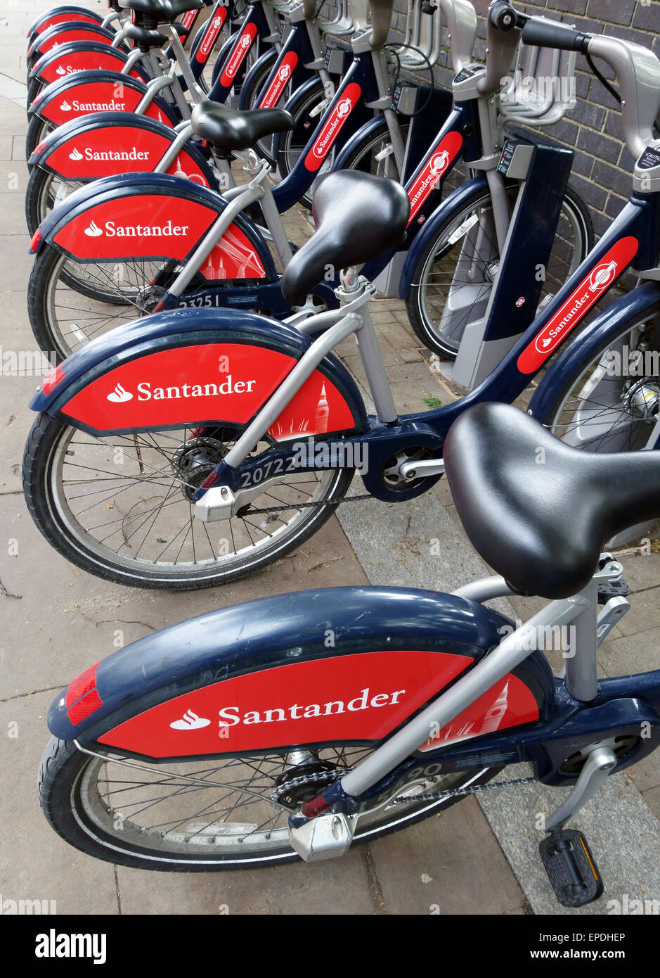 Santander Bank sponsored hire bicycles in docking station, London Stock ...