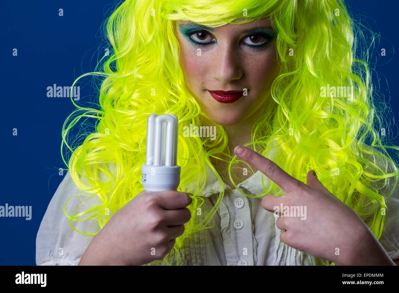 Ecology concept electricity, young girl with a light bulb in hand Stock ...