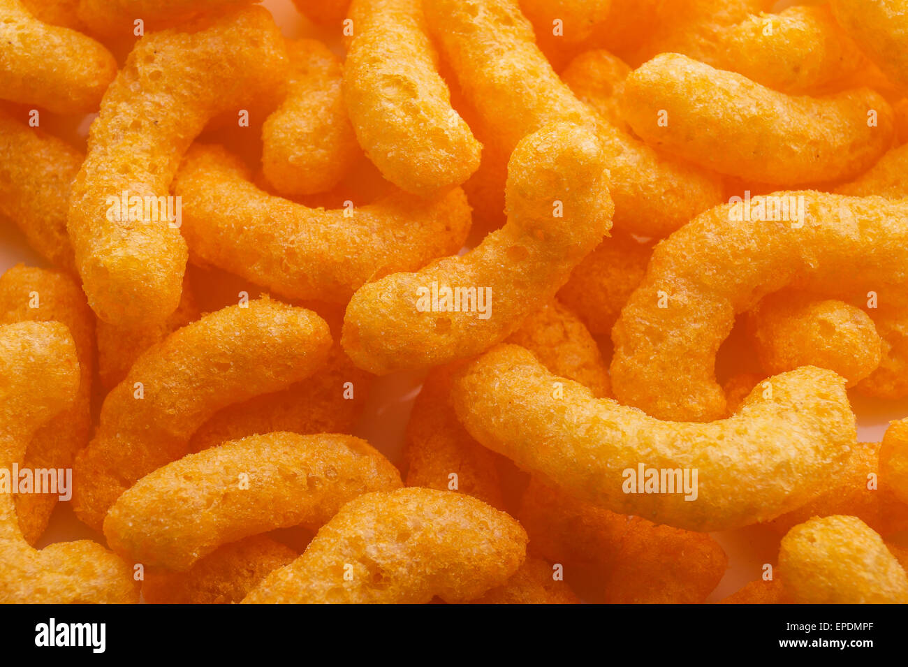 Cheese Puff. yummy snack. Background and macro Stock Photo - Alamy