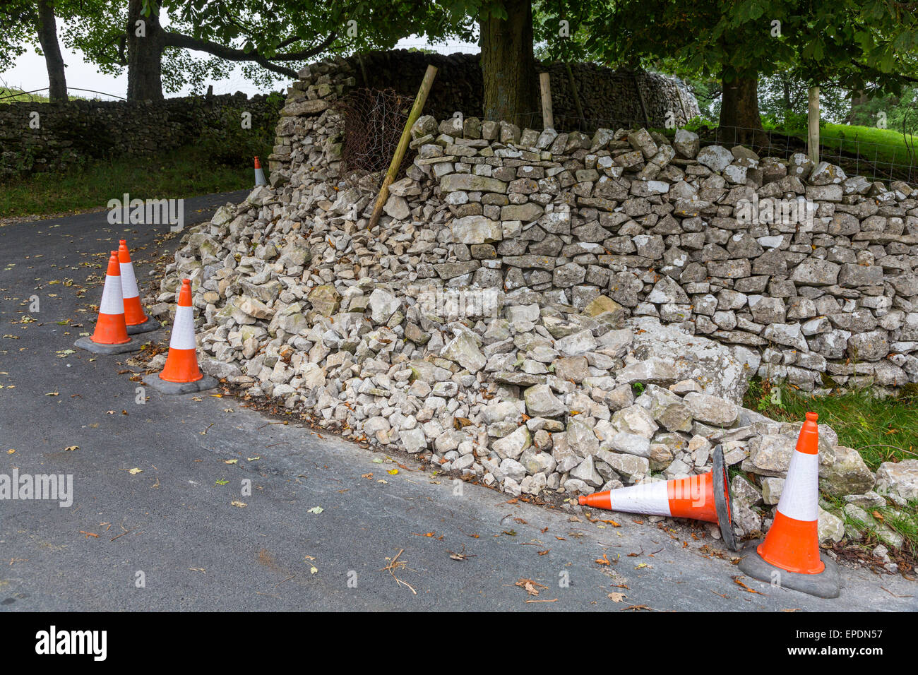 UK, England, Yorkshire Dales. Collapsed Stone Wall and Traffic Alert ...