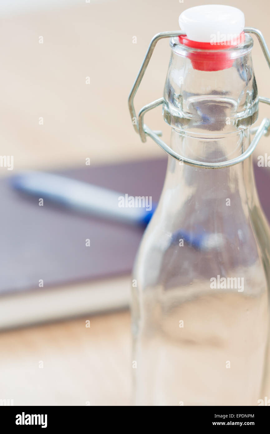 Vintage water bottle on wooden background, stock photo Stock Photo - Alamy