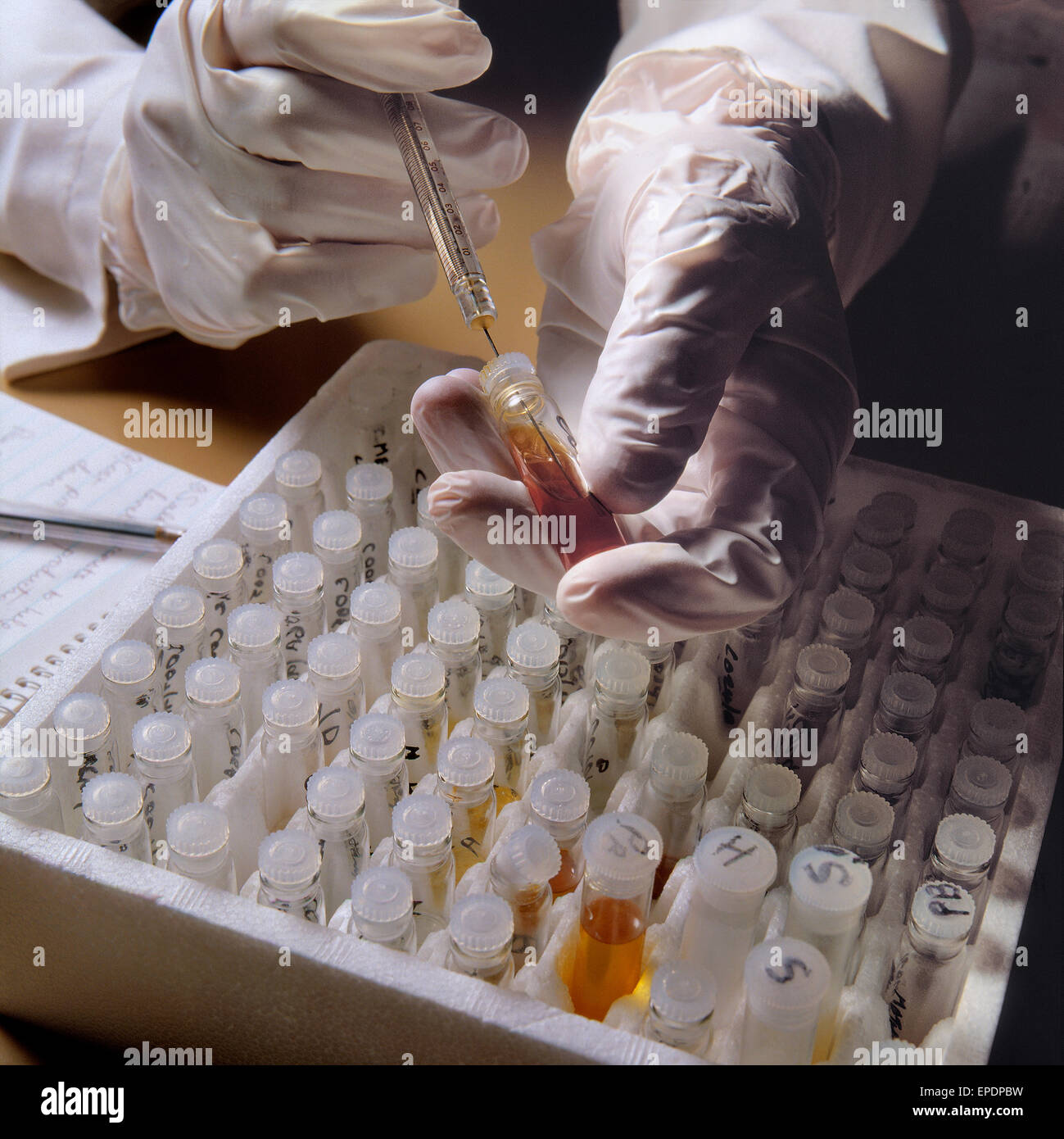 Syringe filling multi-sample laboratory control testing phials prior to ...