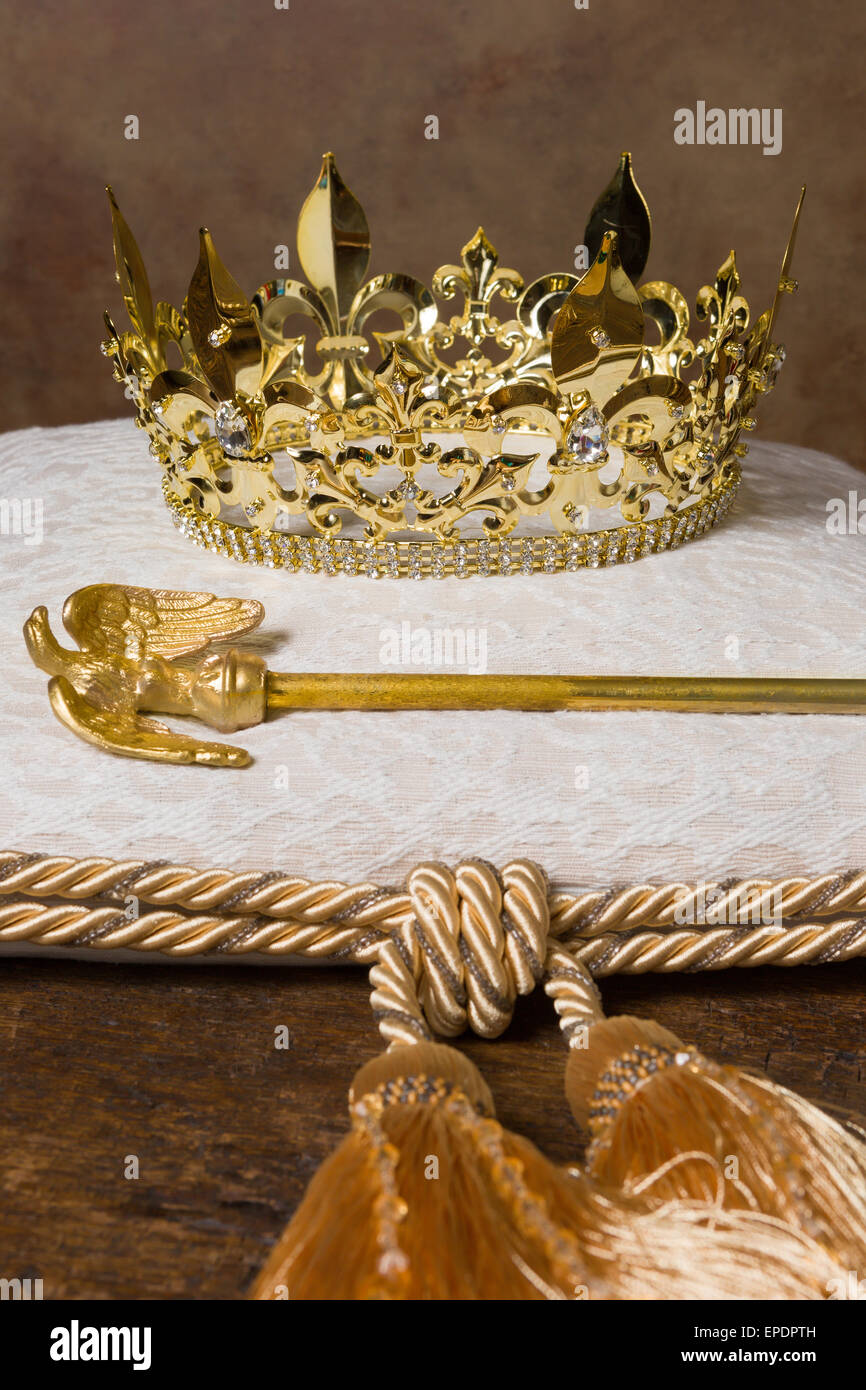 Royal scepter and golden crown on a cream cushion Stock Photo - Alamy