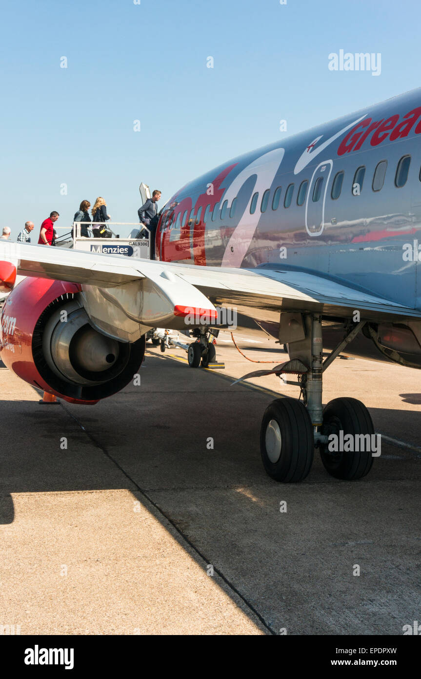 Passengers walking up steps to board a Jet 2.Com Boeing 737 aeroplane ...