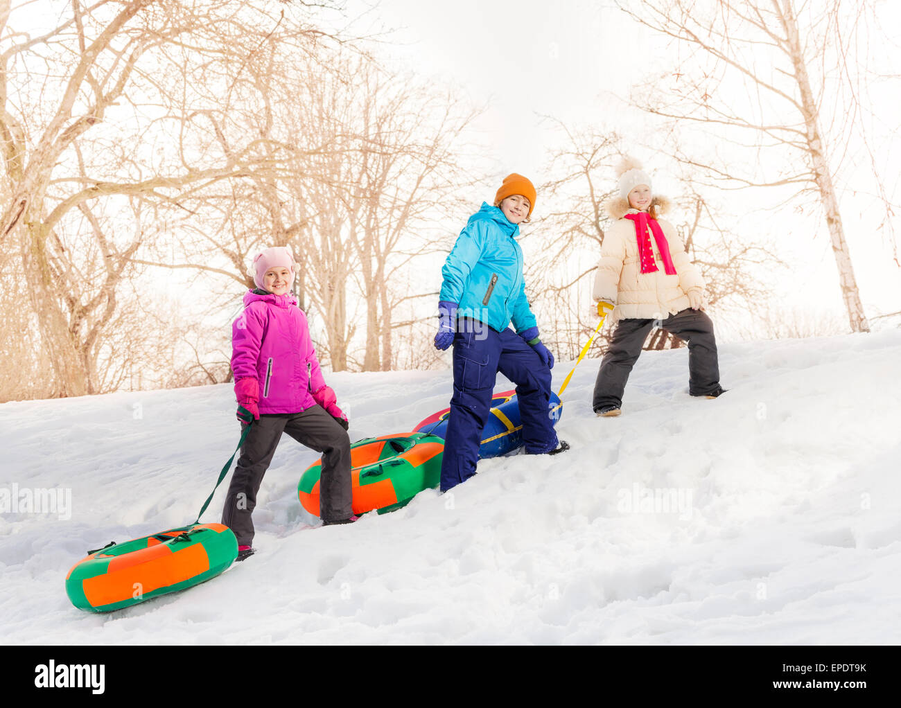 Three children stand outside hi-res stock photography and images - Alamy