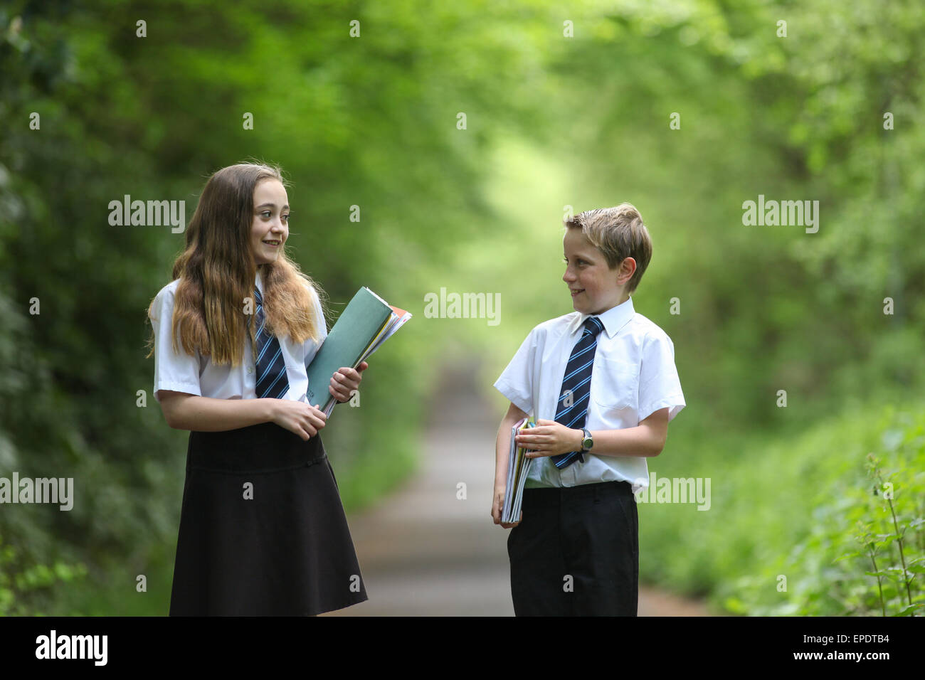 School pupils in uniform walking to school UK Stock Photo - Alamy