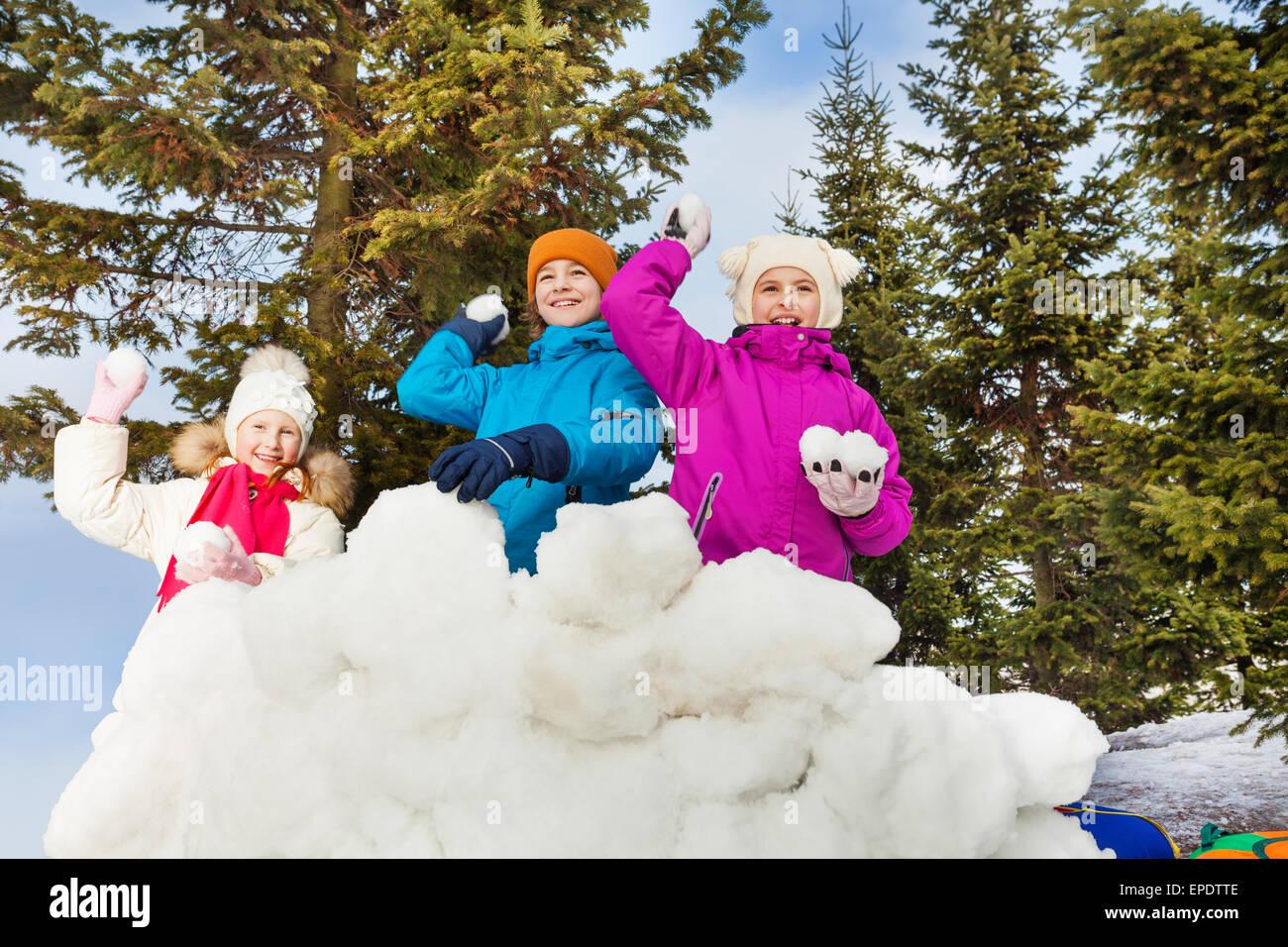 Group of kids play snowballs game together Stock Photo - Alamy