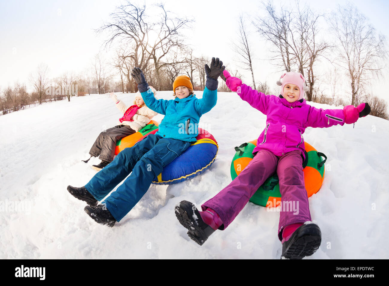 Three kids sliding down hi-res stock photography and images - Alamy