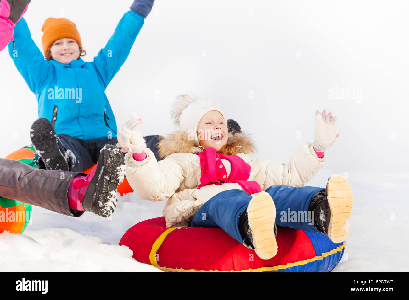 Laughing girl and boy sliding down on the tubes Stock Photo - Alamy