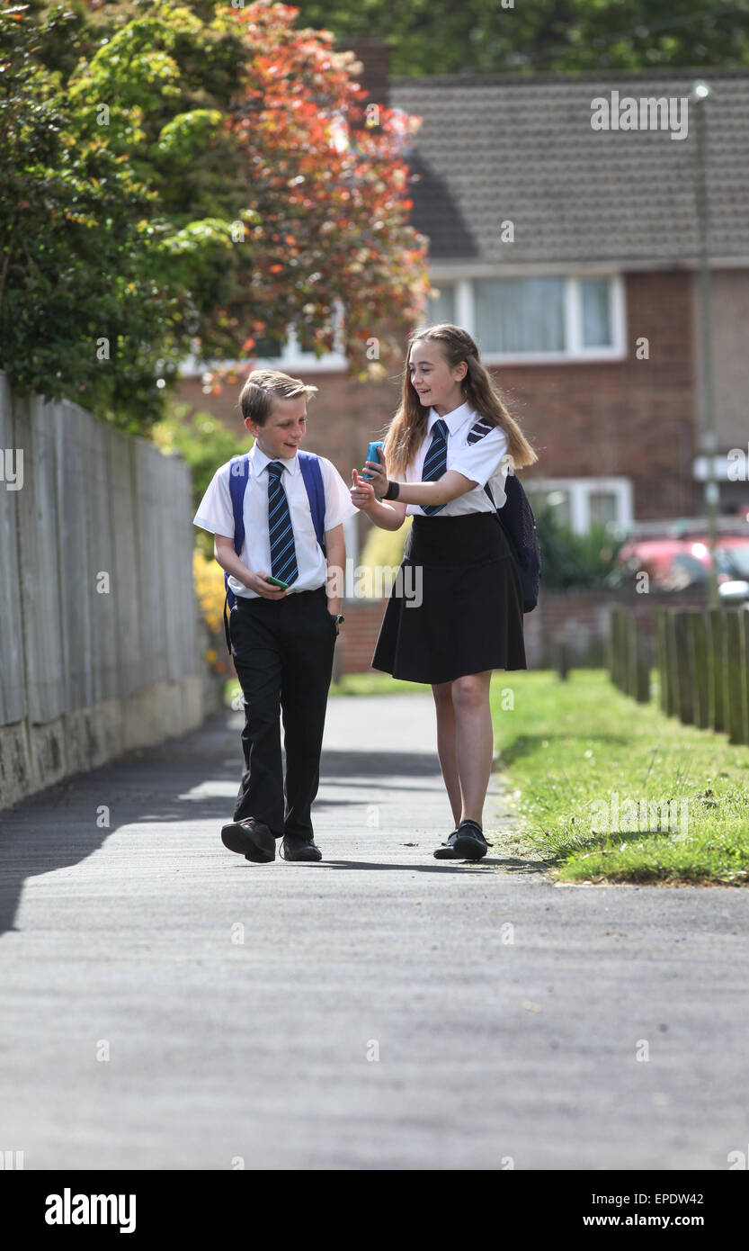 School pupils in uniform walking to school UK Stock Photo - Alamy