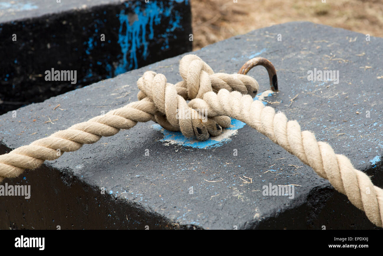 Rope on Block of Concrete with paint Stock Photo - Alamy