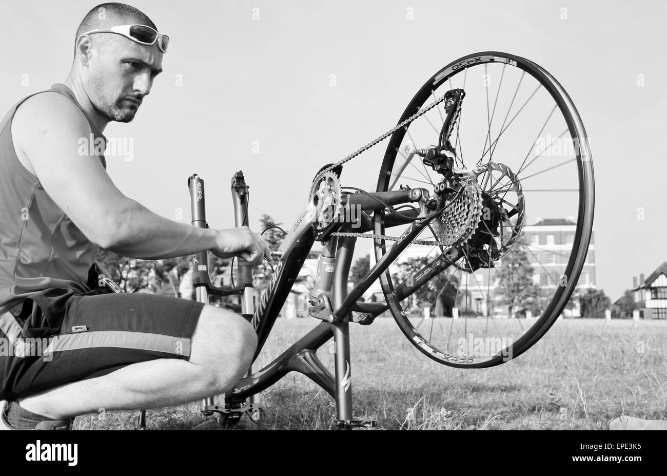 Man fixes bike in in park repair, bike, biking, outdoor, rider, park ...