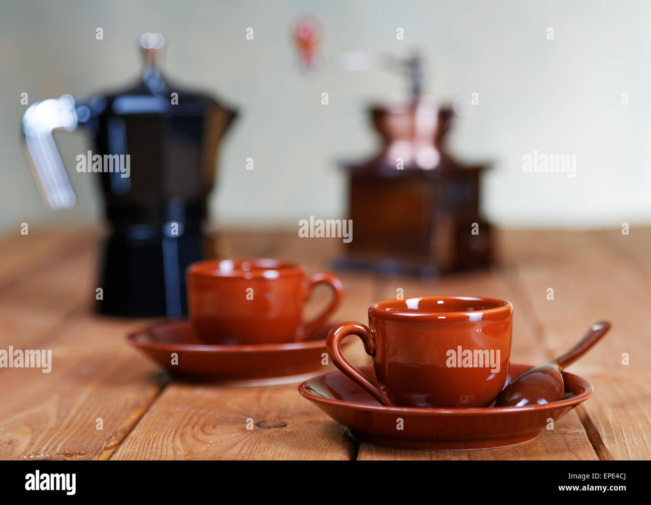 Cups of coffee and a coffee pot on a rural table Stock Photo - Alamy