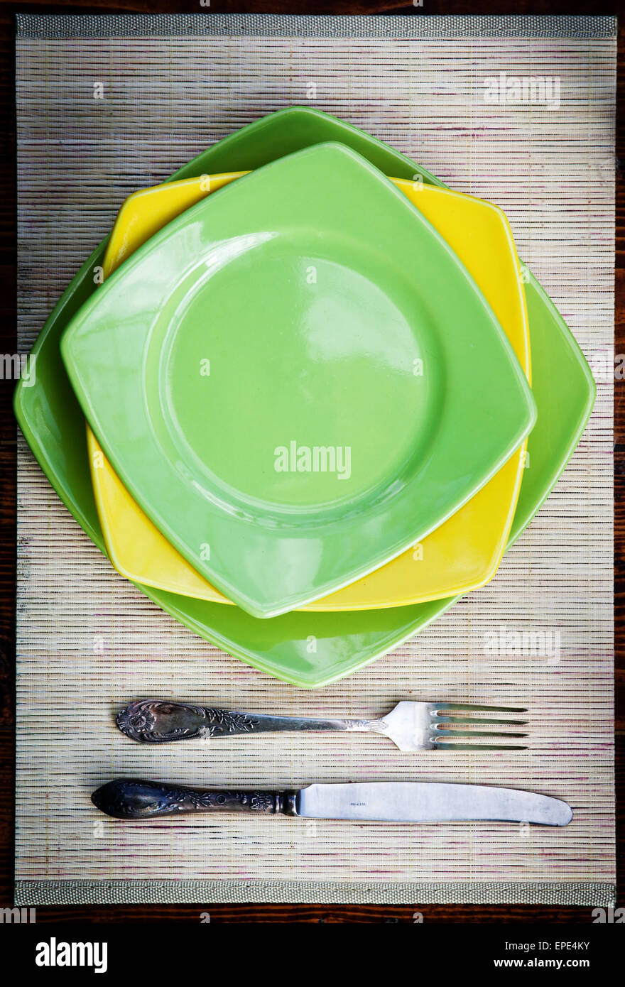 Table setting for two with empty plates - rustic wooden table Stock ...