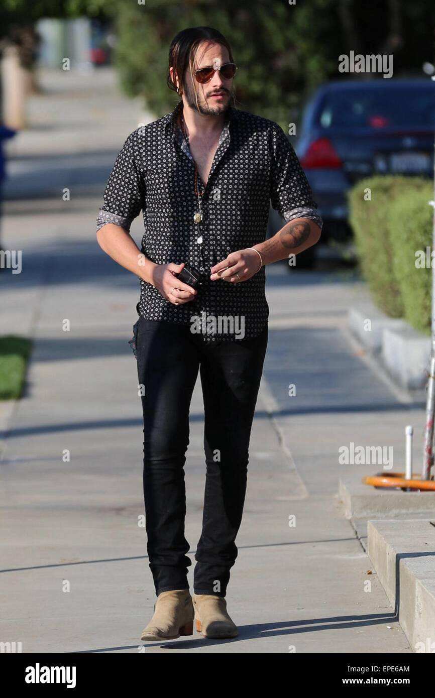 Marco Perego exits the Andy LeCompte hair salon with wet hair ...