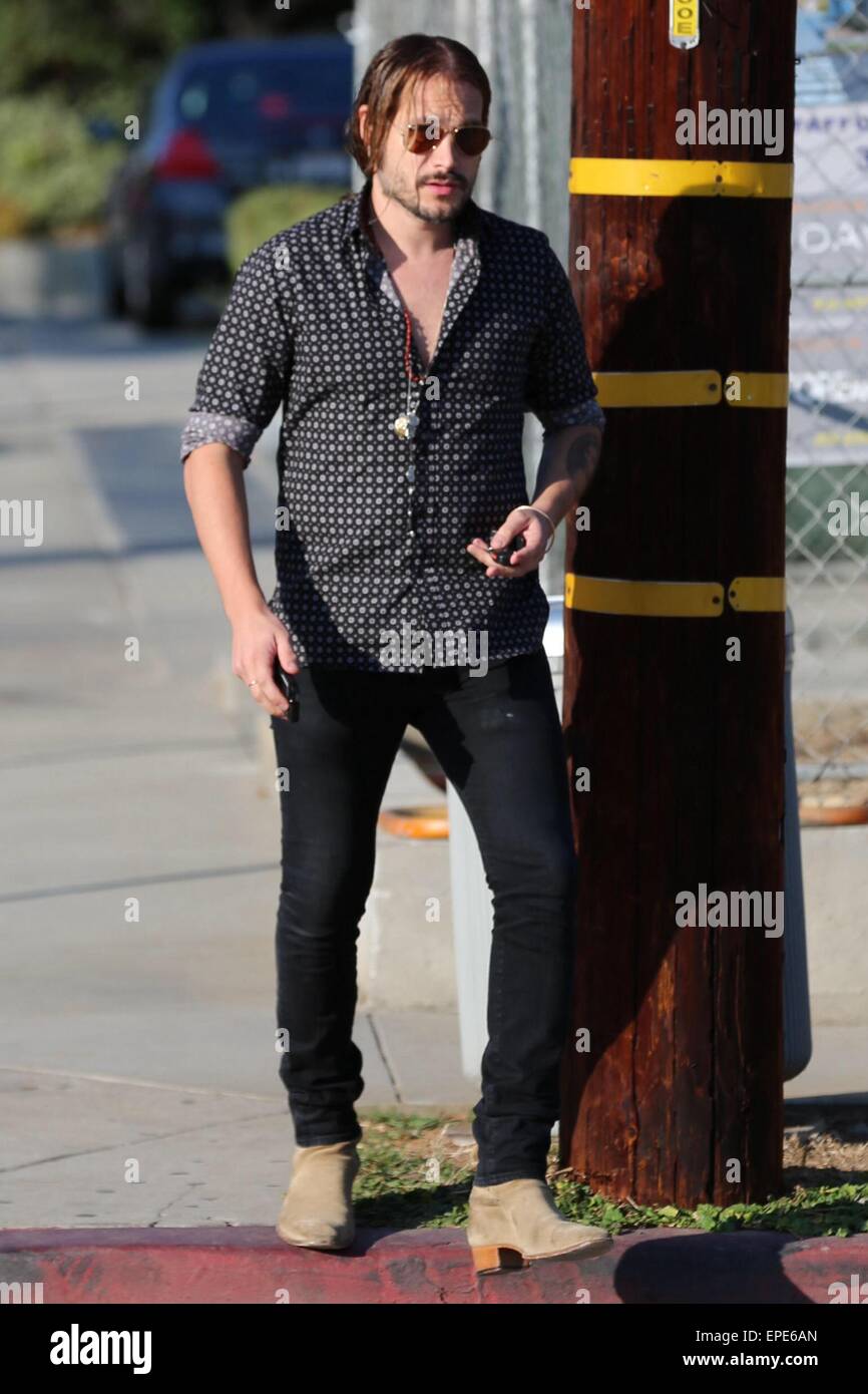 Marco Perego exits the Andy LeCompte hair salon with wet hair ...