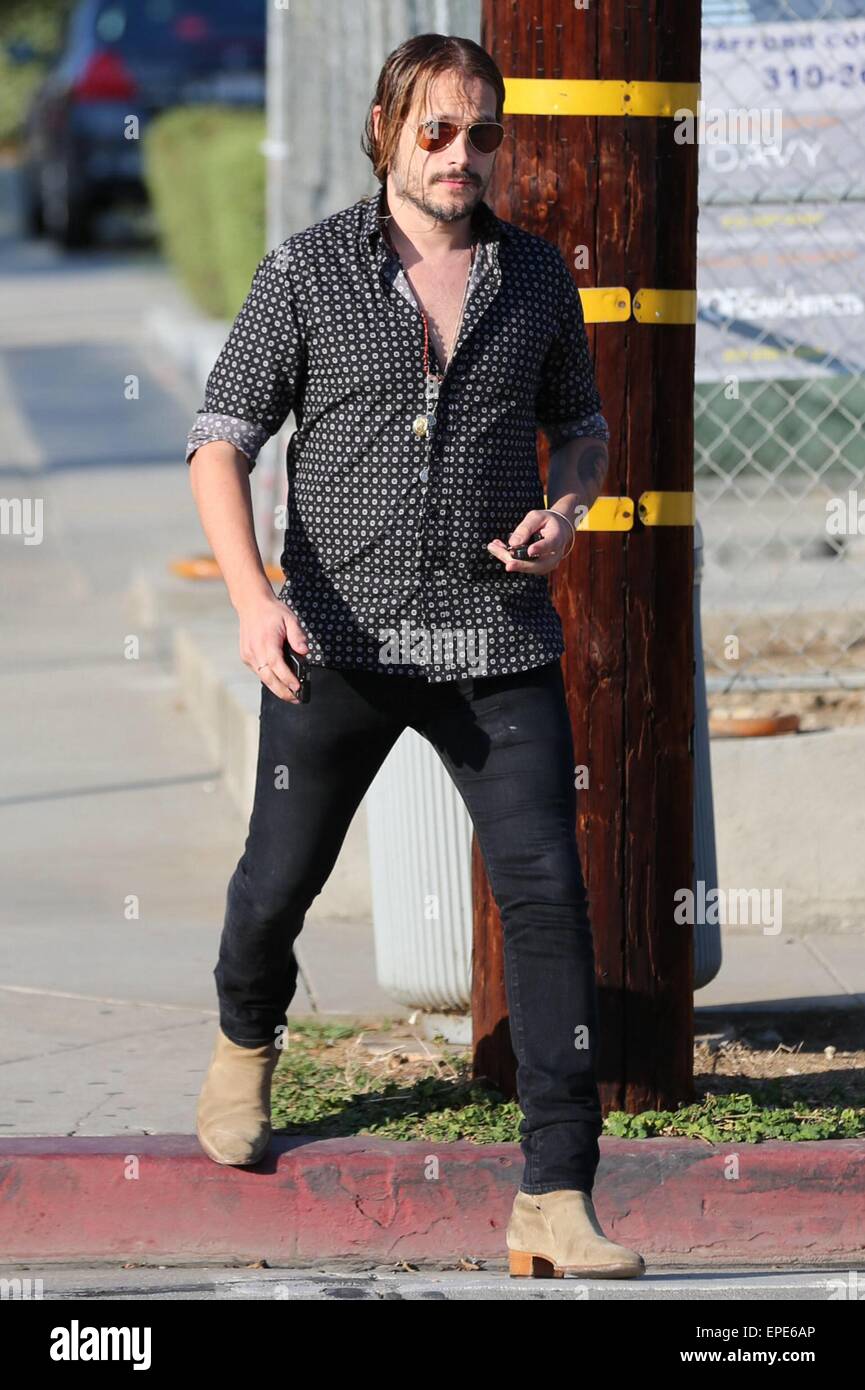 Marco Perego exits the Andy LeCompte hair salon with wet hair ...