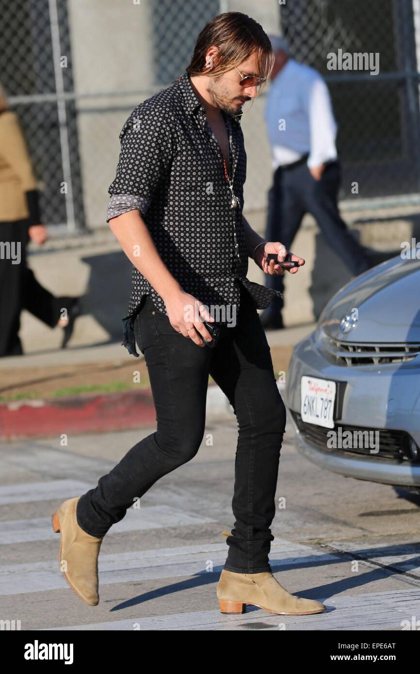 Marco Perego exits the Andy LeCompte hair salon with wet hair ...