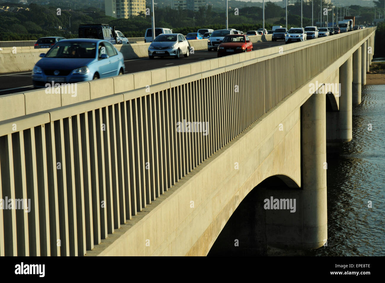 Early morning traffic of cars crossing Umgeni river bridge with ...