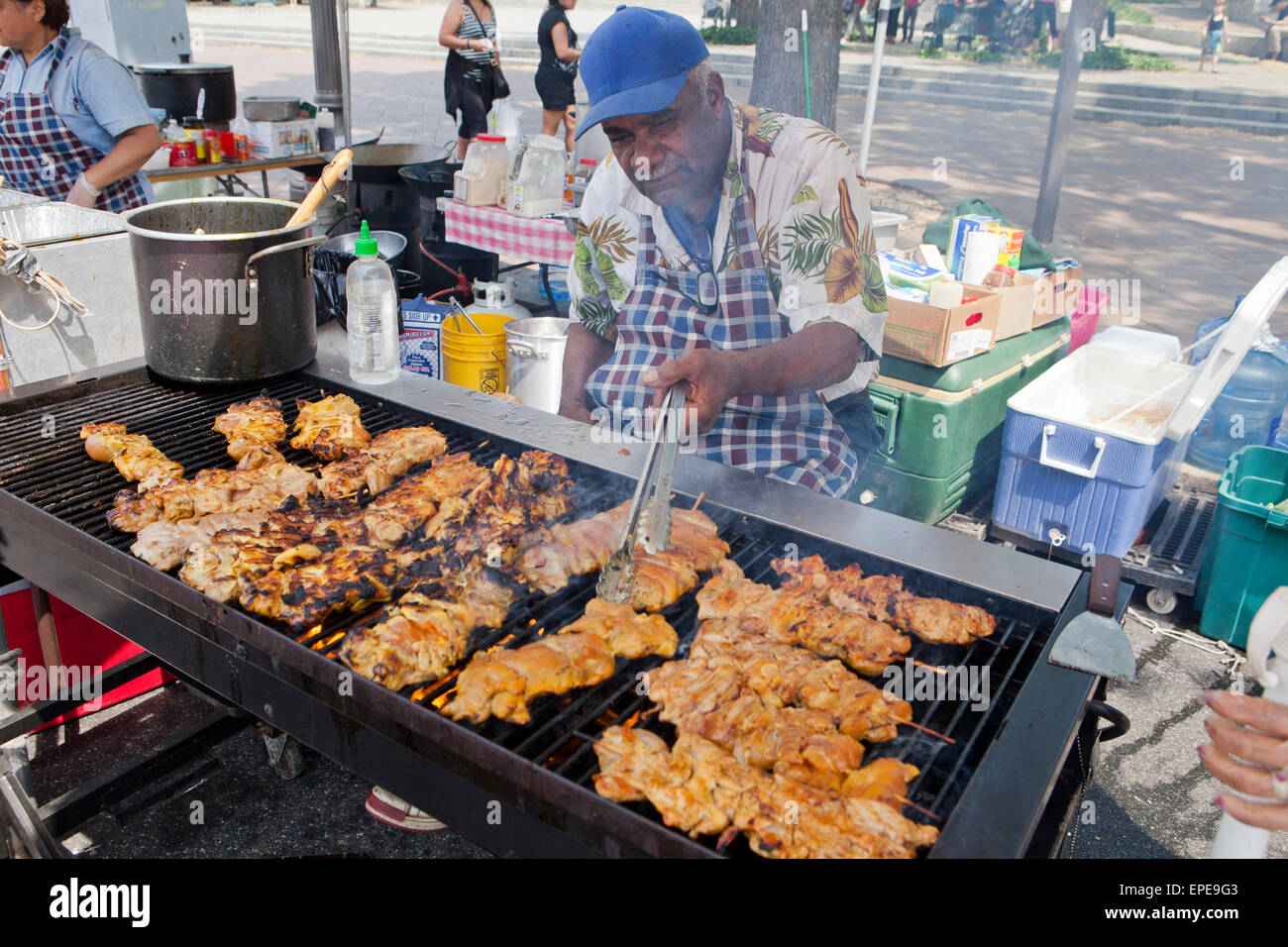 Man cooking chicken skewers kebabs hi-res stock photography and images ...