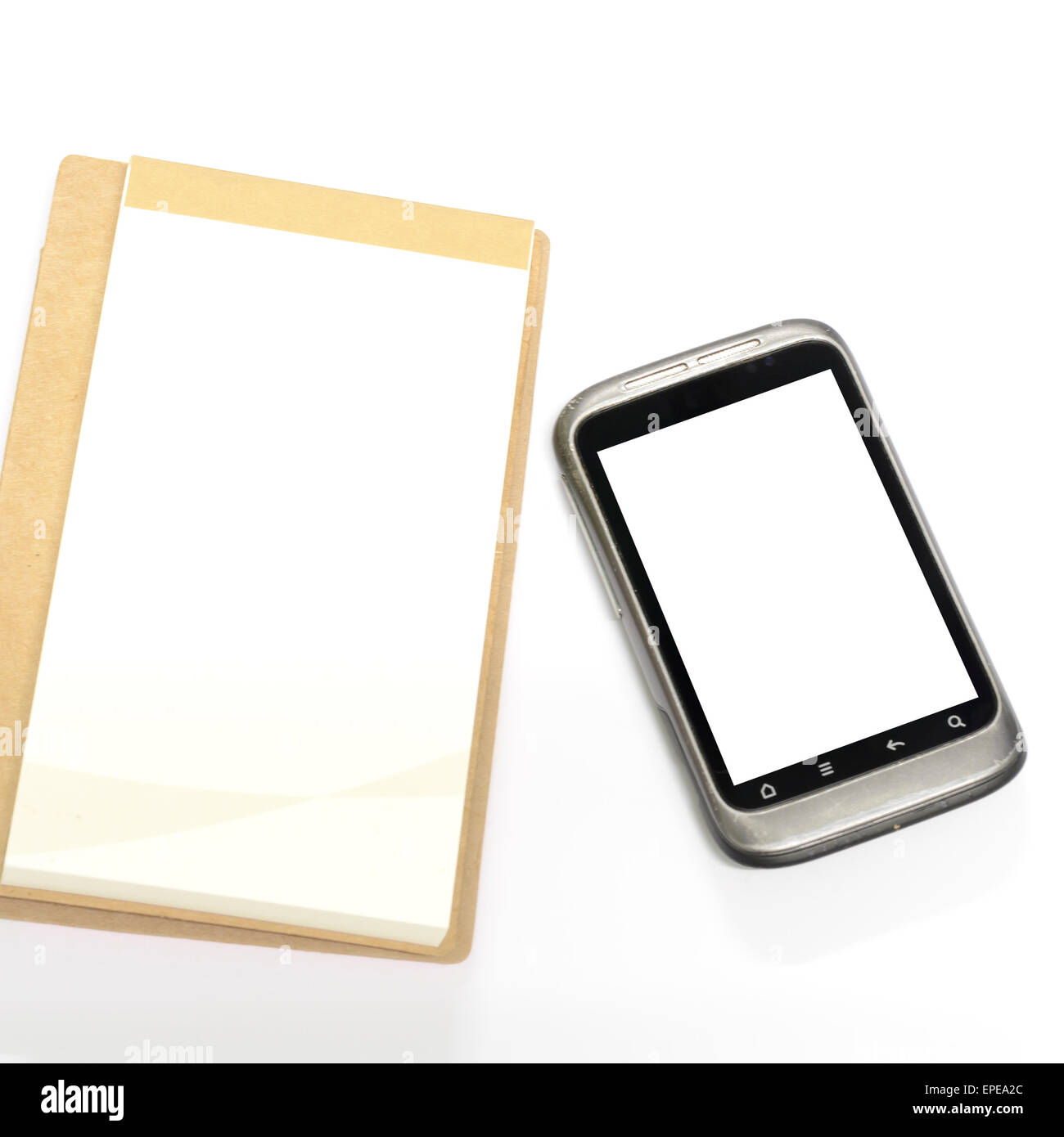 used smartphone with note book on a white background Stock Photo - Alamy