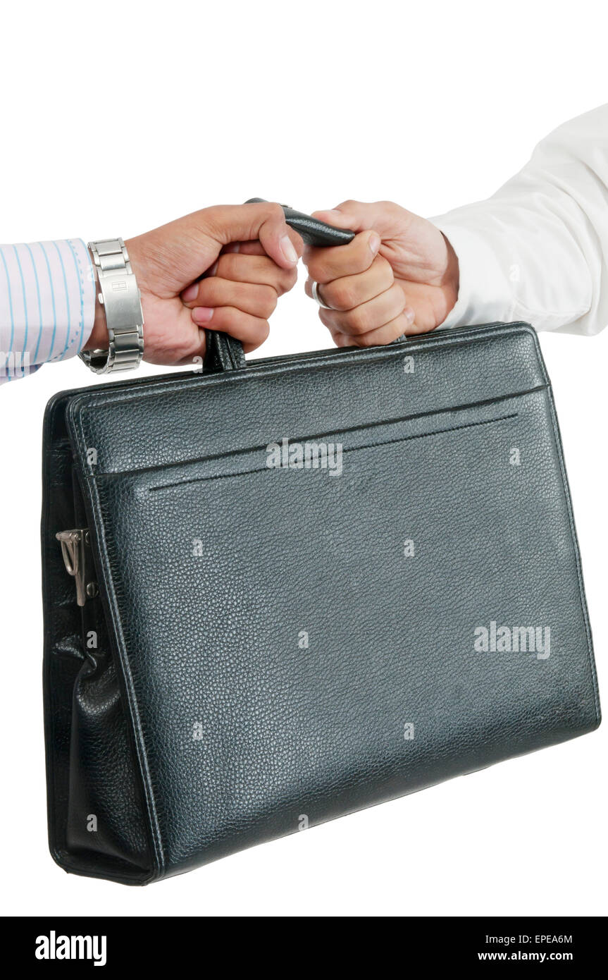Businessman pulling executive bag Stock Photo - Alamy