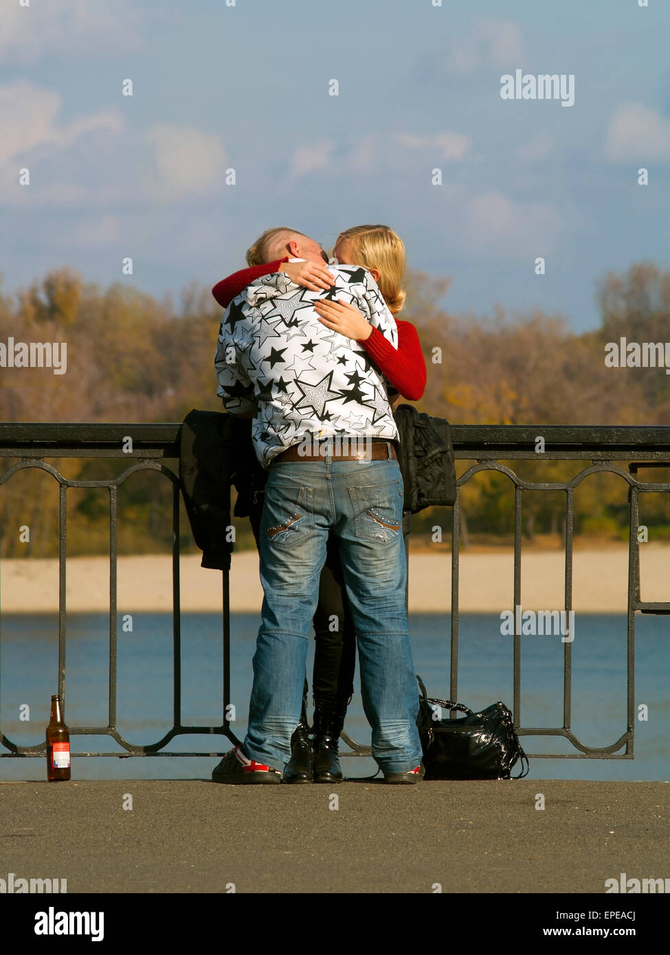 Two young men are kissing on the bridge Stock Photo - Alamy