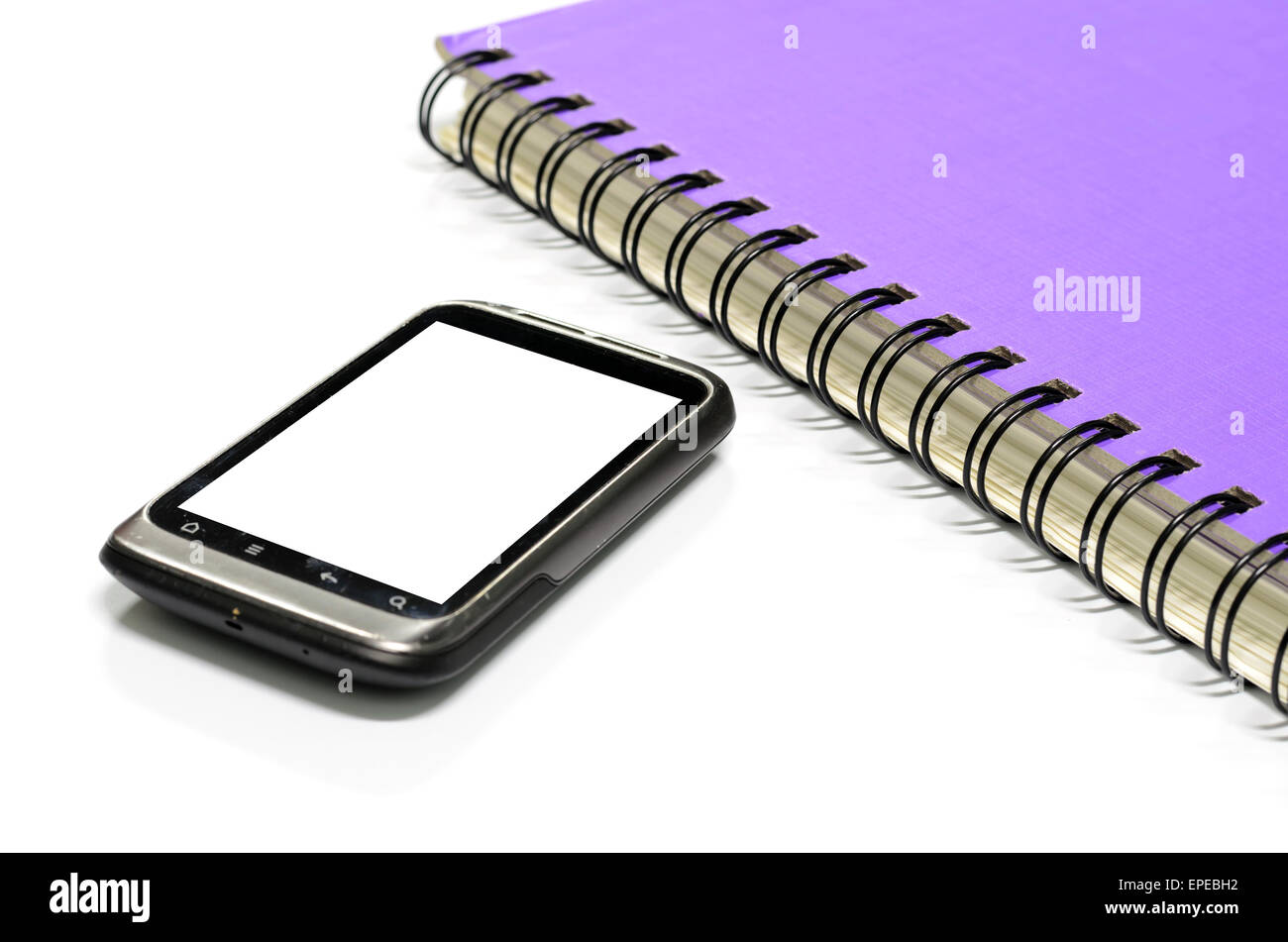 used smartphone with grey note book on a white background Stock Photo ...