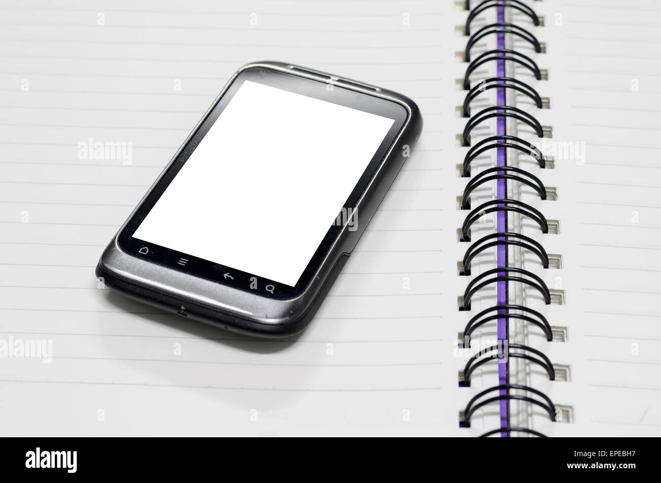 used smartphone with note book Stock Photo - Alamy
