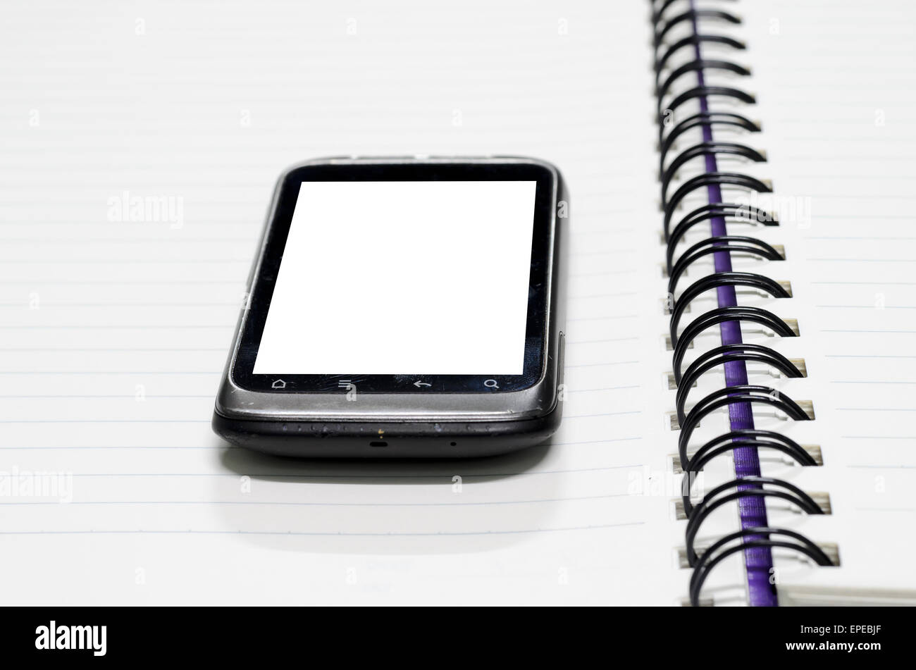 used smartphone with note book Stock Photo - Alamy