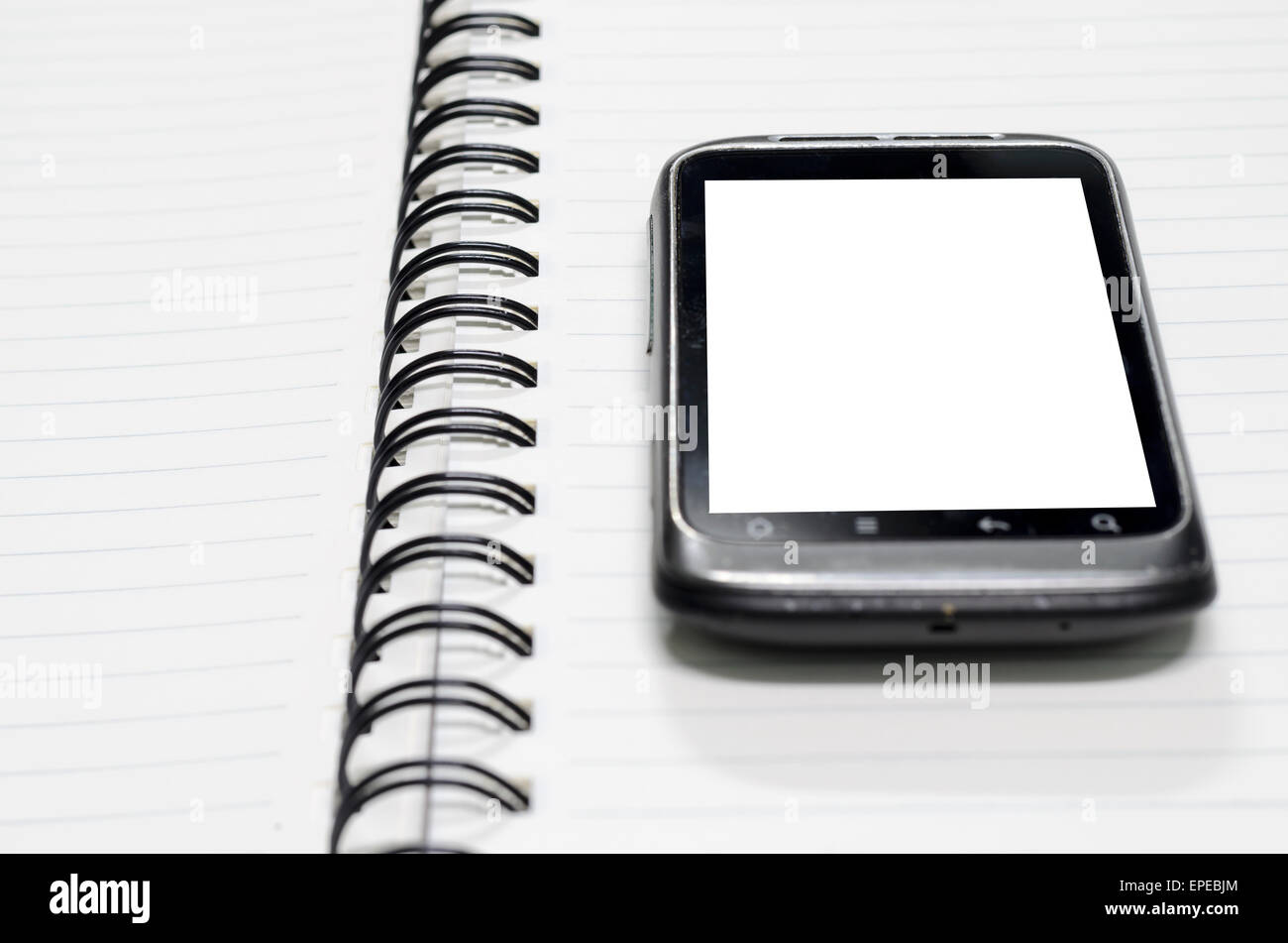 used smartphone with note book Stock Photo - Alamy