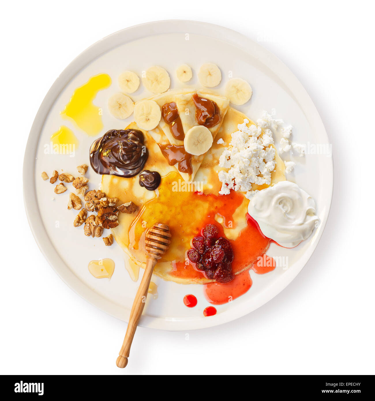 Crepes on a dish with various toppings Stock Photo - Alamy